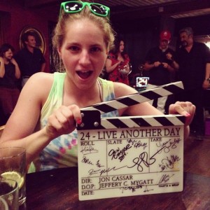 Stunt performer Casey Michaels poses with the signed clapper board from ...